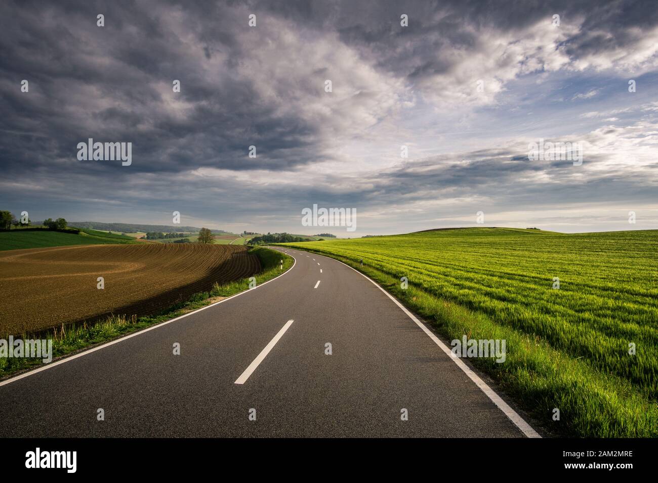 roadtrip with a dramatic sky and unknown destination Stock Photo - Alamy