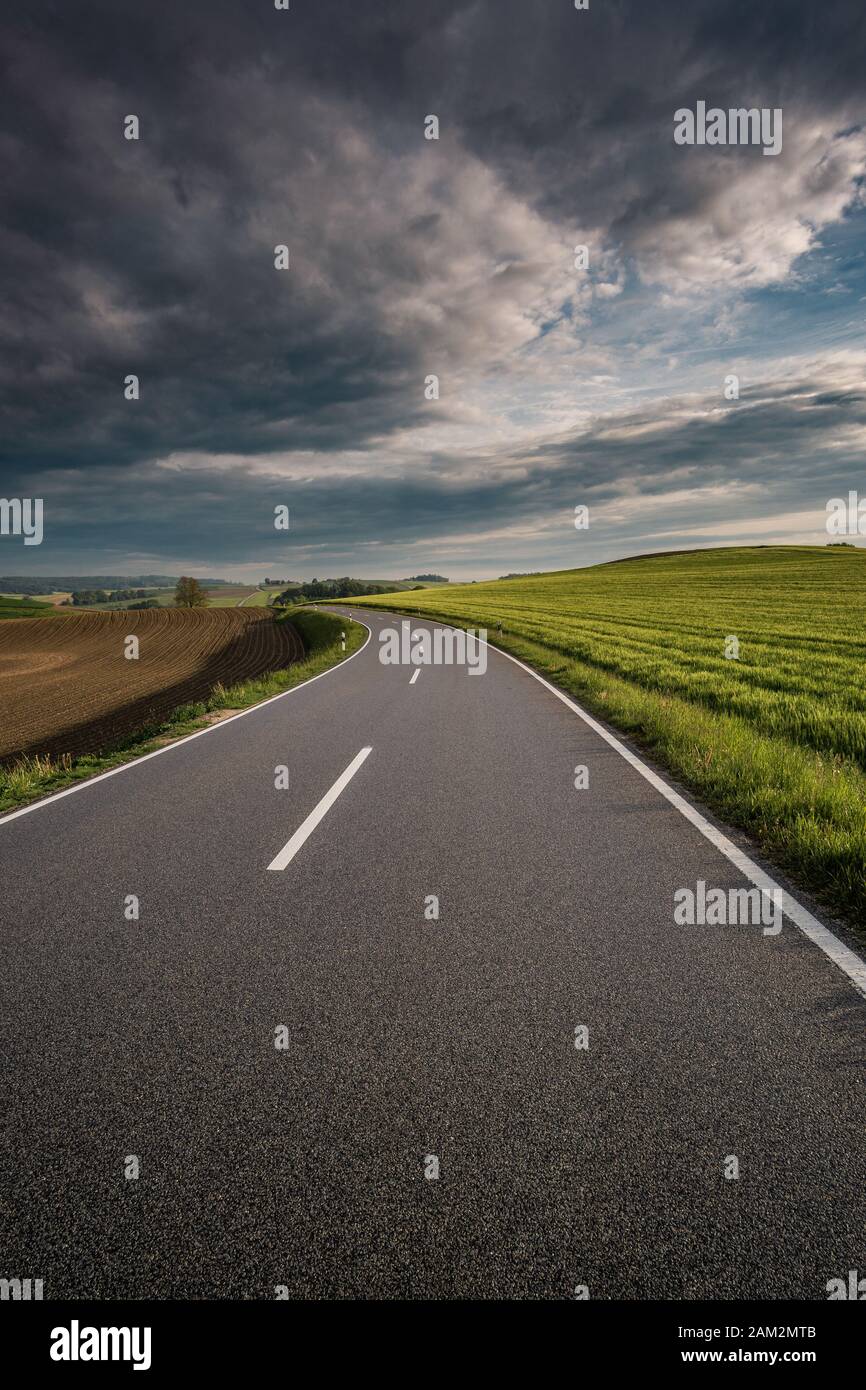 roadtrip with a dramatic sky and unknown destination Stock Photo - Alamy