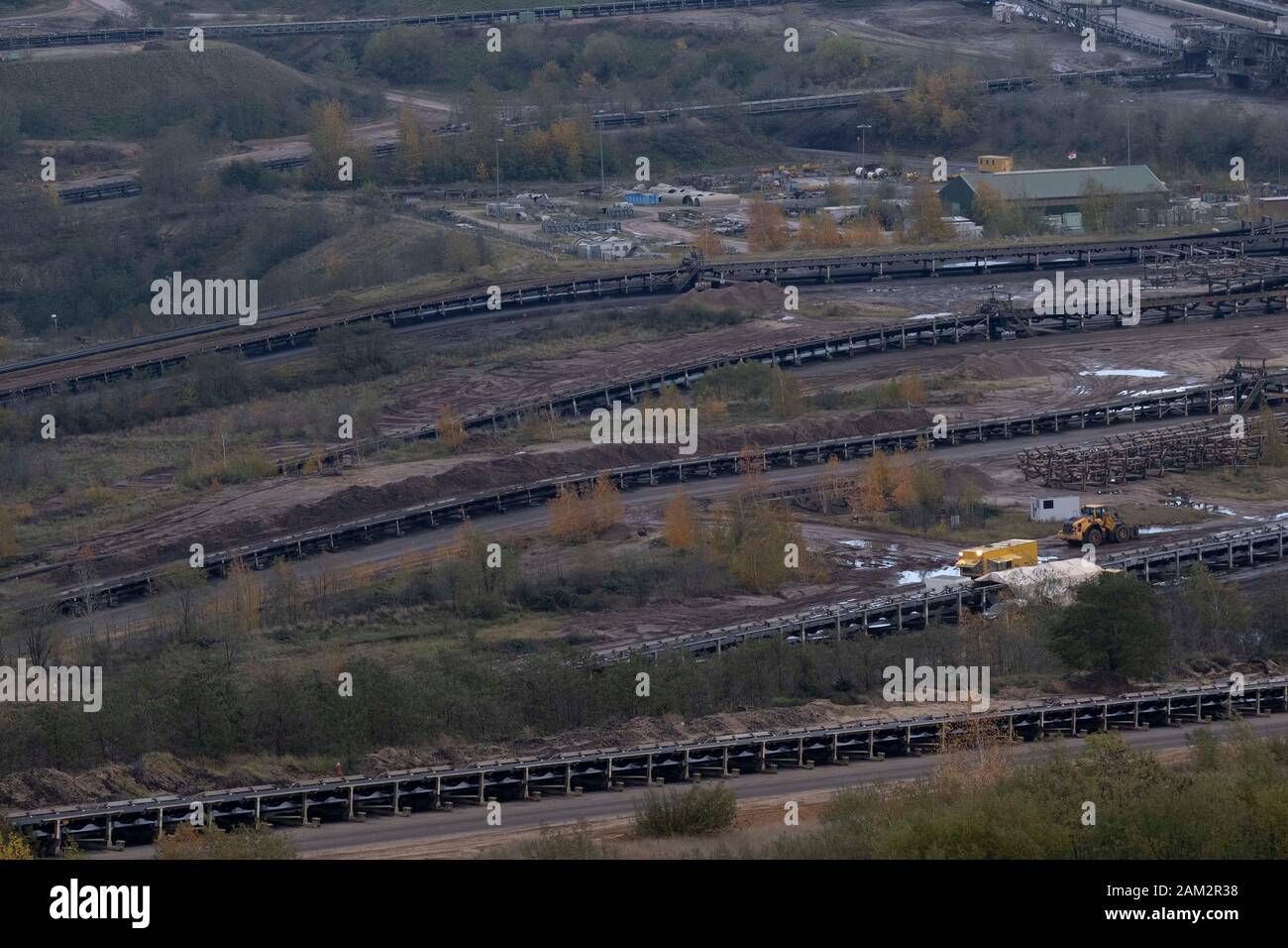 Multiple rail tracks near open pit coal mine, Garzweiller, Germany ...