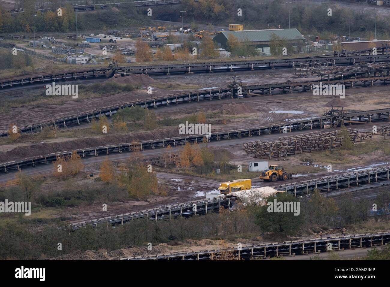 Multiple rail tracks near open pit coal mine, Garzweiller, Germany ...