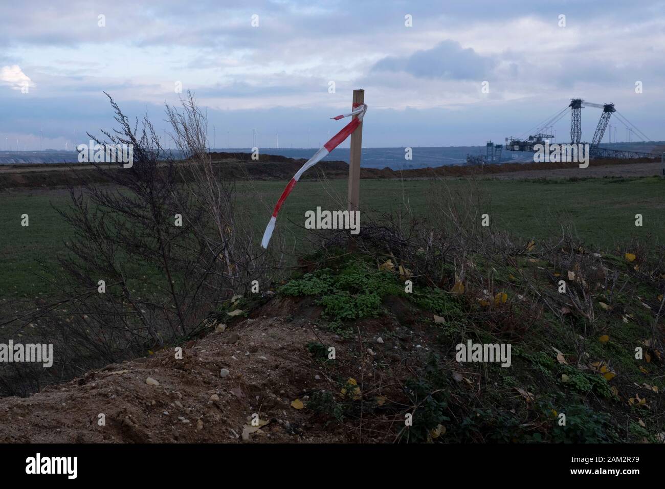 Broken barrier near open pit coal mine, bucket wheel excavator in ...