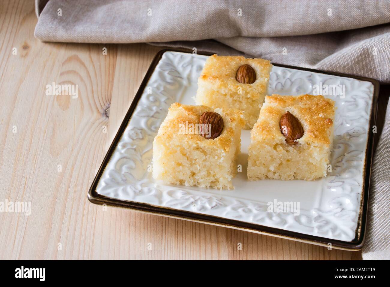 Basbousa (namoora) traditional arabic semolina cake with almond and ...