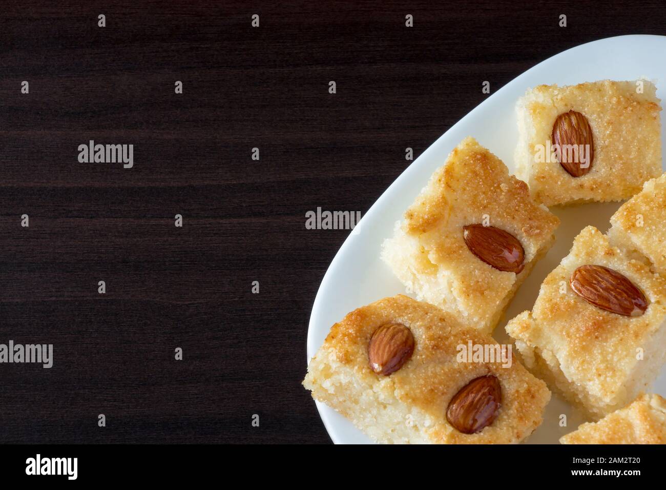Basbousa (namoora) traditional arabic semolina cake with almond and ...