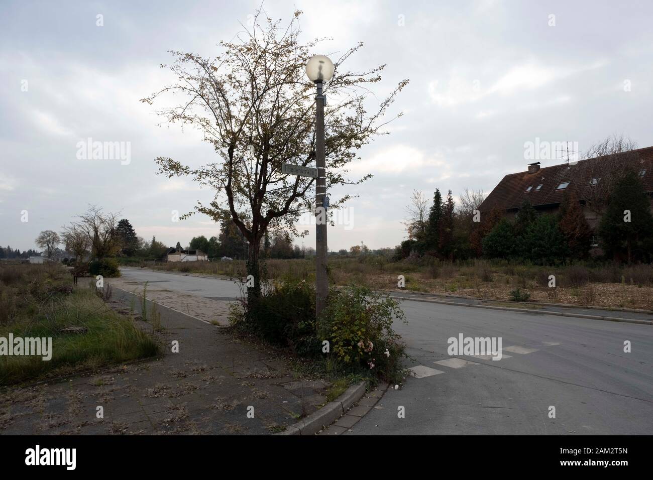 Lone lamp post by roadside in abandoned coal mining town of Mannheim ...