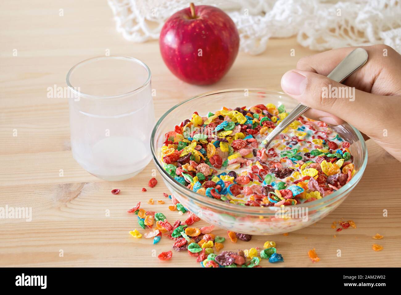 Kids healthy quick breakfast. Colorful rice cereal with milk and apple ...