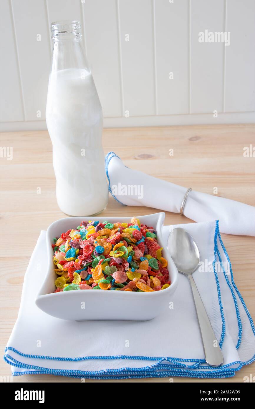 Kids healthy quick breakfast. Colorful rice cereal and bottle milk for ...