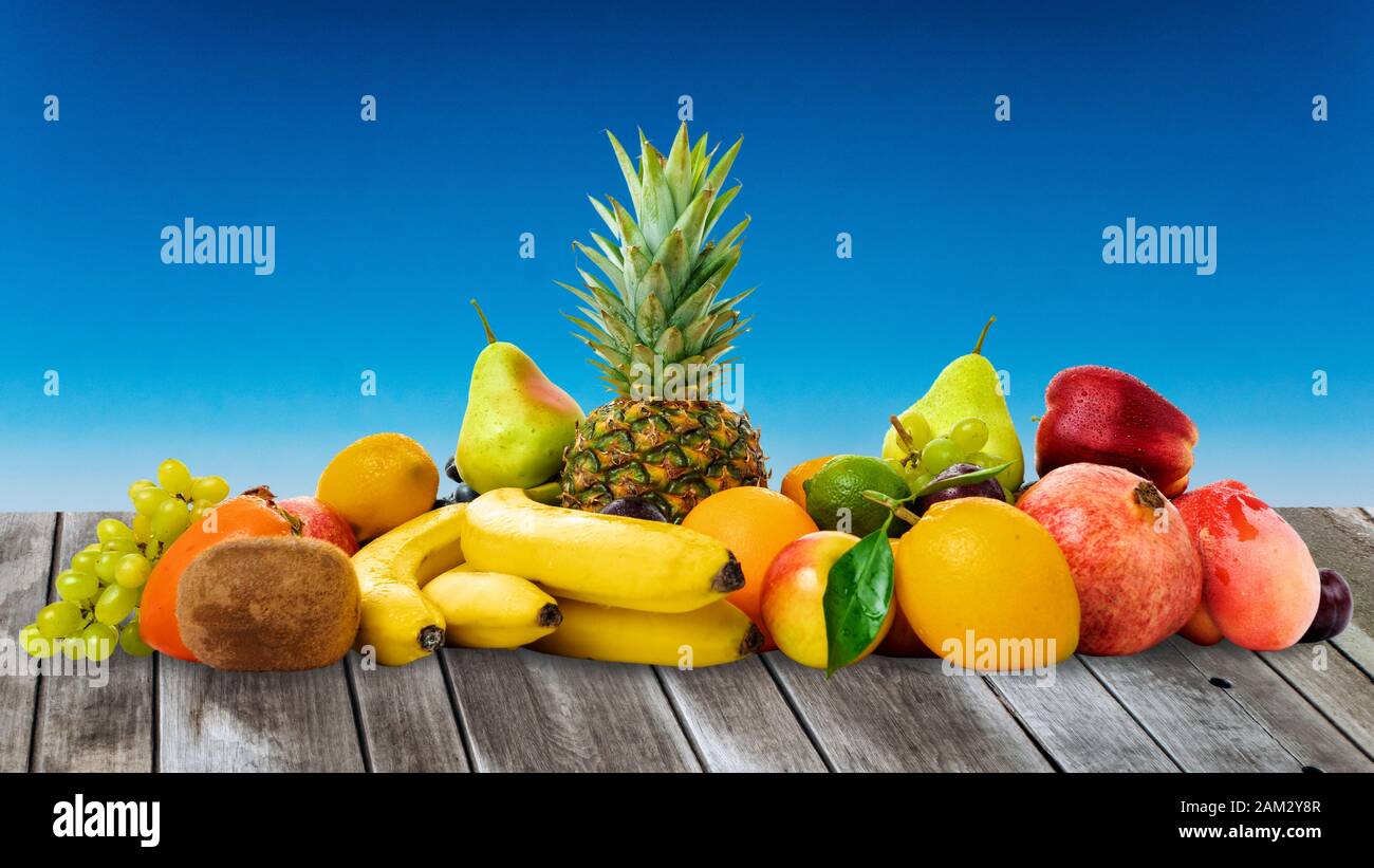 set of different fruits on table. Fresh summer fruits Stock Photo - Alamy