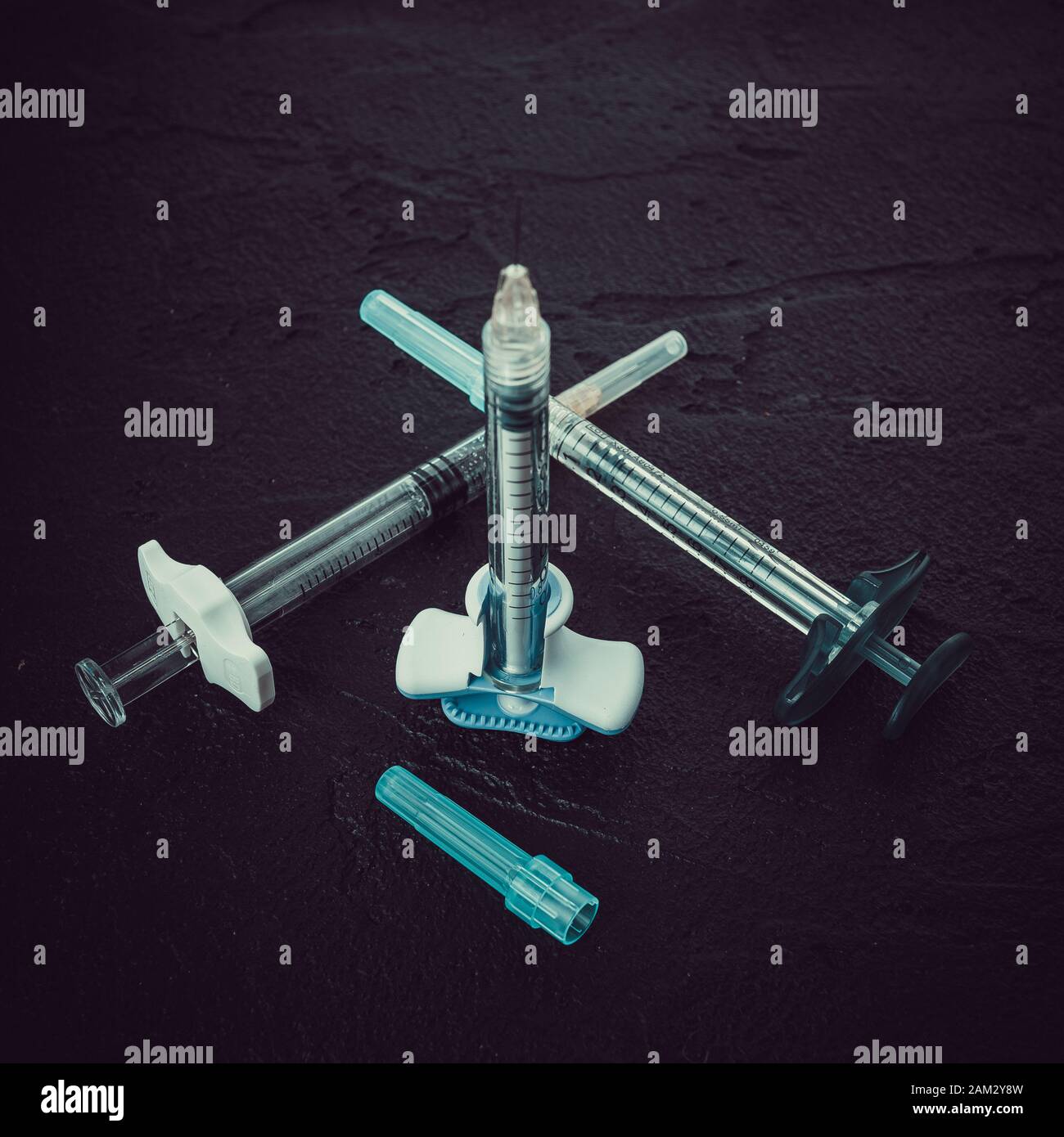 Medical injection syringes with solution on black background Stock ...