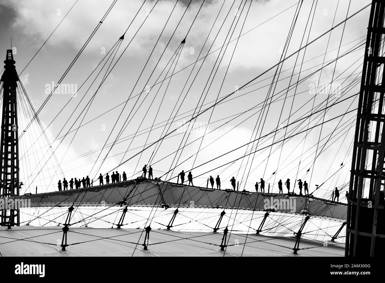 O2 Arena Greenwich London UK Black & White image. Silhouette of walkers ...