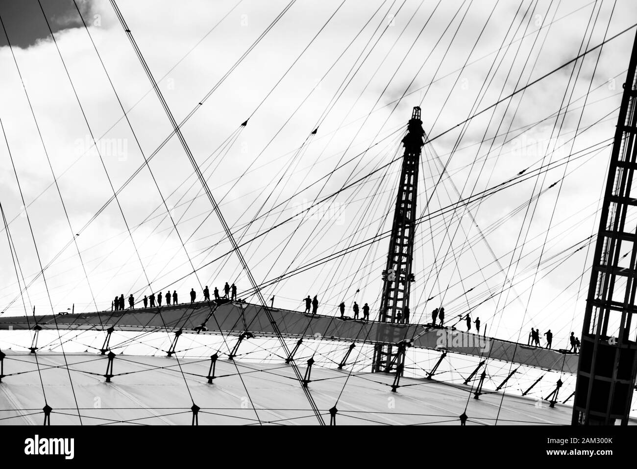 O2 Arena Greenwich London UK Black & White image. Silhouette of walkers ...