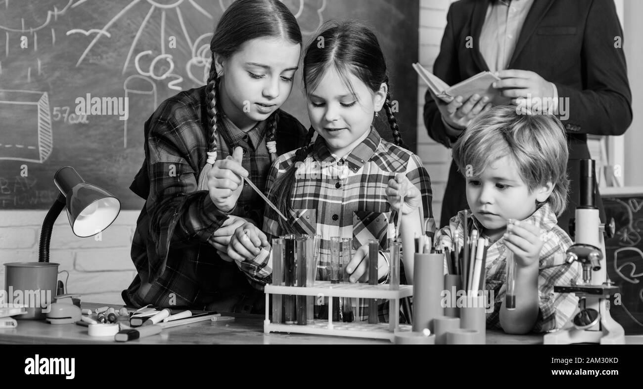 happy children teacher. back to school. kids in lab coat learning ...