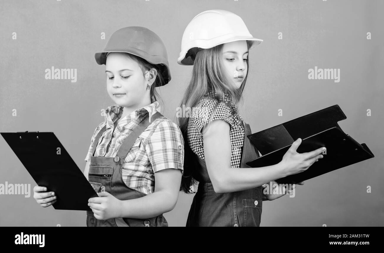 Checking every detail for defects. small girls repairing together in ...