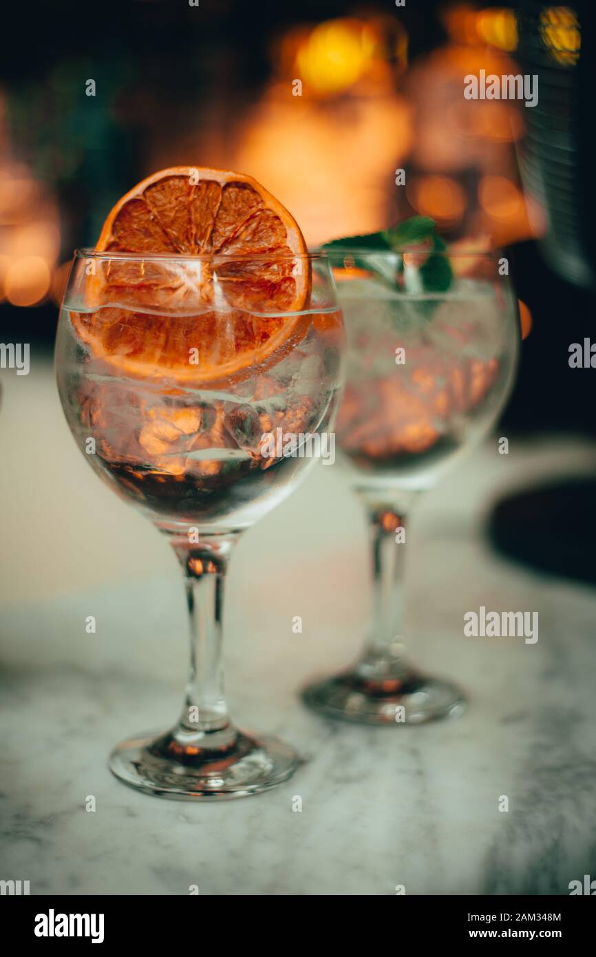 Two gin tonic standing on a bar counter Stock Photo - Alamy