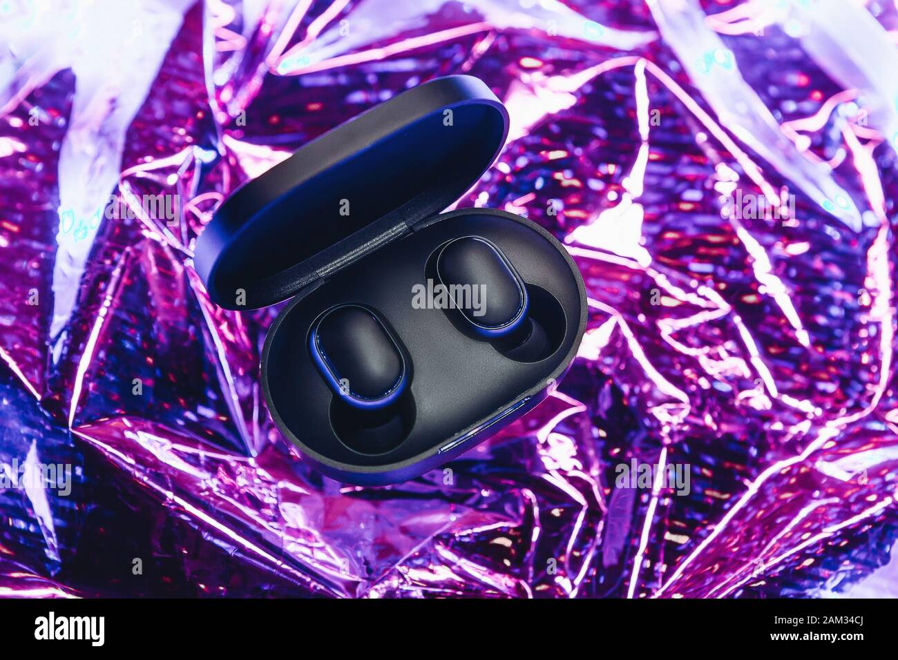 Wireless headphones on a trendy neon color gradient background Stock ...