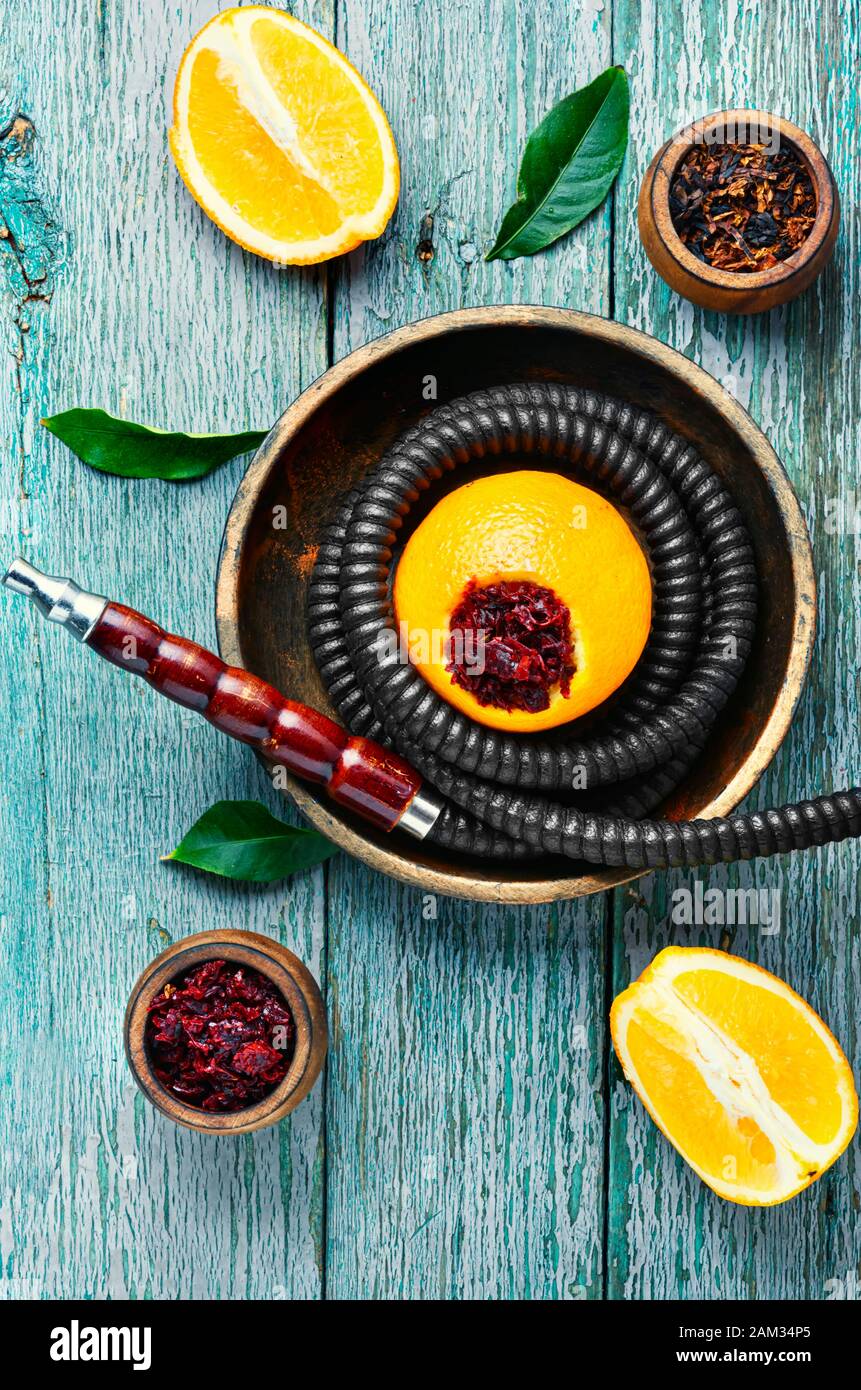Details of tobacco hookah and tobacco with orange aroma.Fruit shisha ...