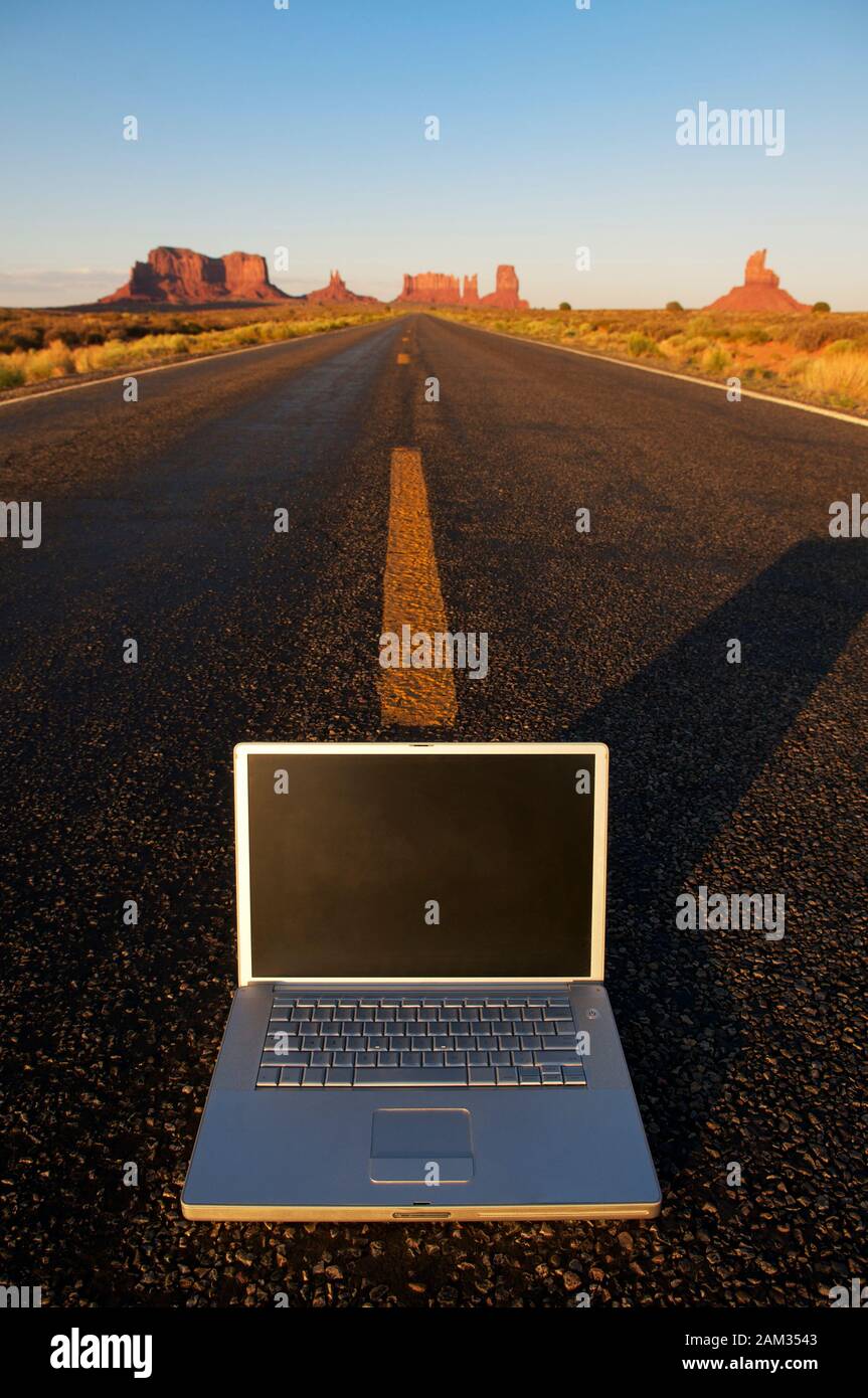 Golden sunset view of laptop computer with blank screen sitting on ...