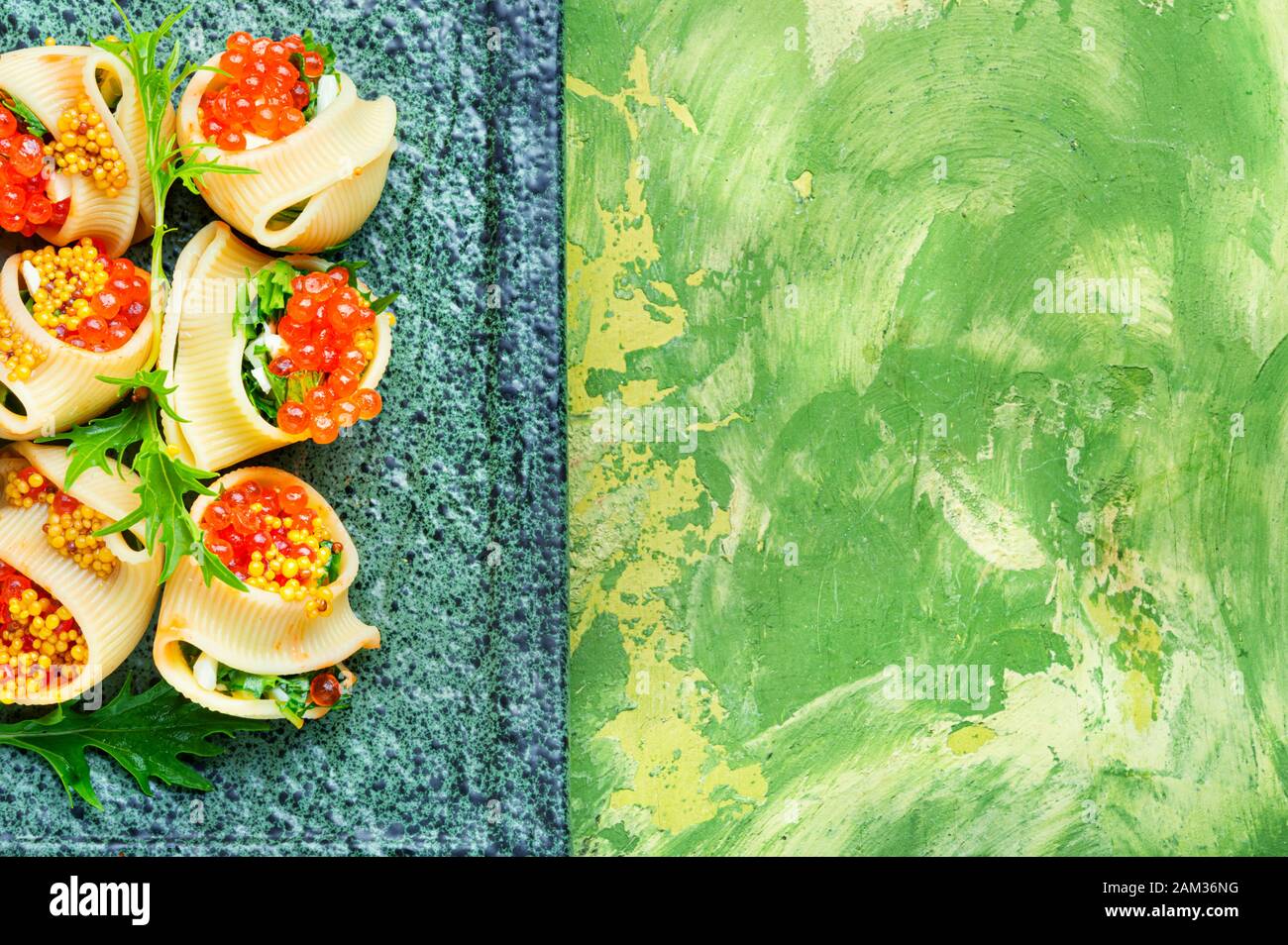 Festive, banquet pasta dish stuffed with red caviar.Macaroni stuffed ...