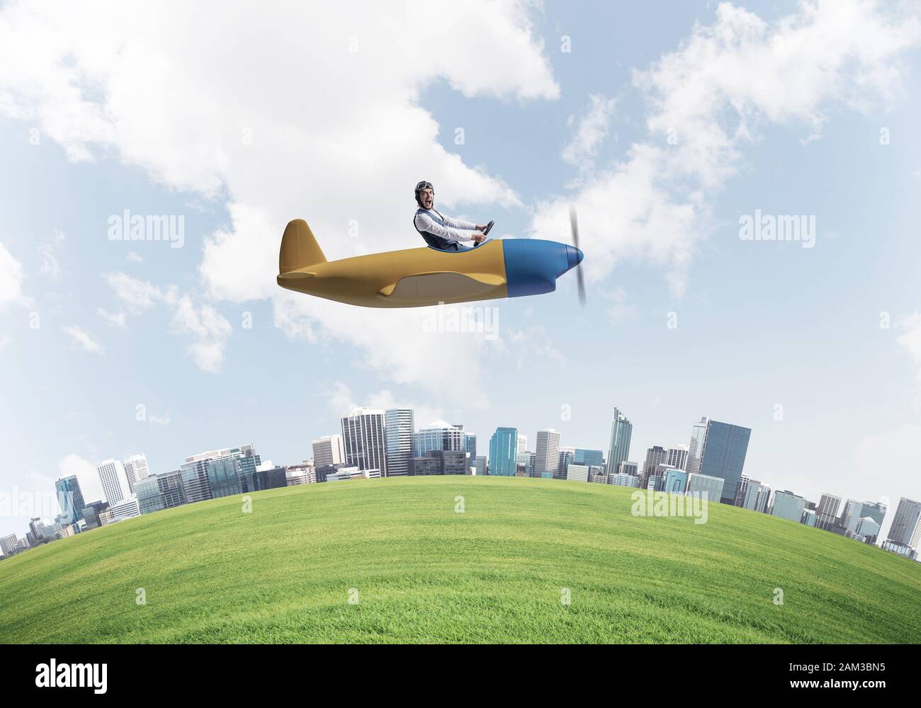 Screaming businessman in leather helmet flying Stock Photo - Alamy