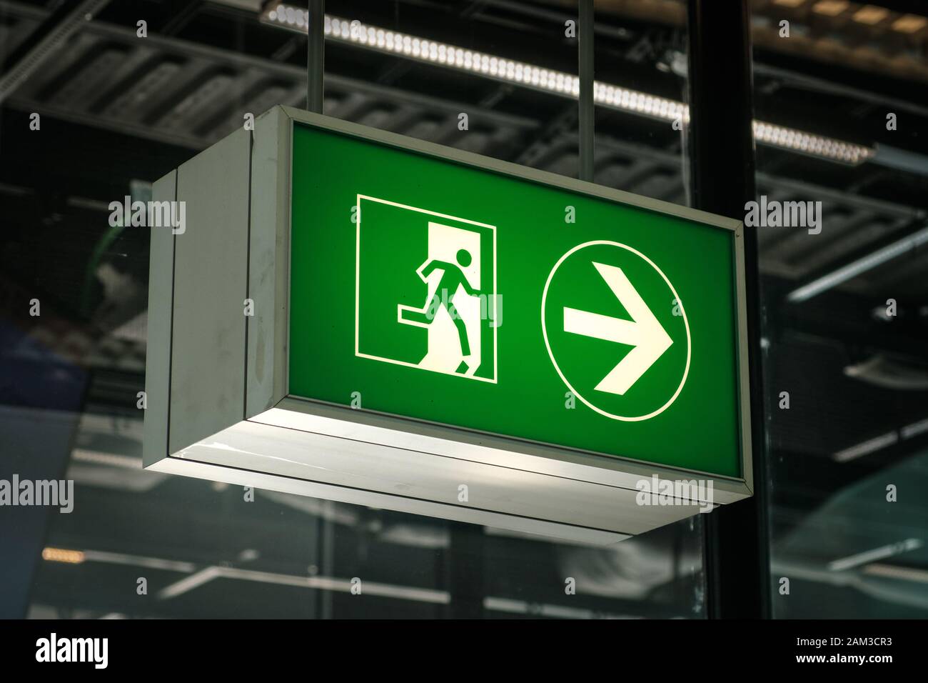 Emergency Exit sign on airport closeup Stock Photo - Alamy