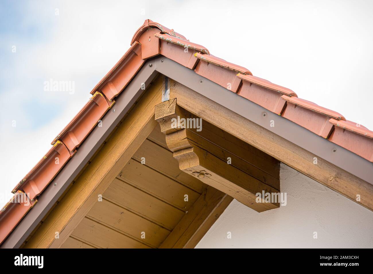 Gable at the front facade. Roof covered with red tiles Stock Photo - Alamy