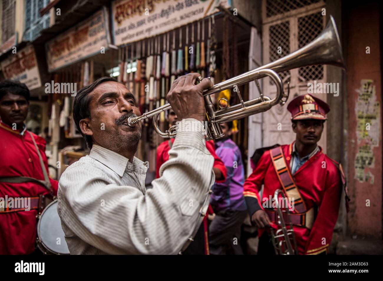 Indian man playing trumpet hi-res stock photography and images - Alamy