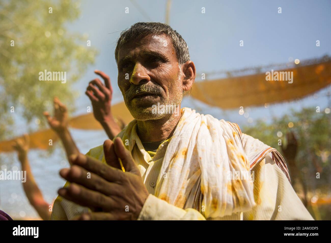 Man praying during Holi. Mathura, India Stock Photo - Alamy
