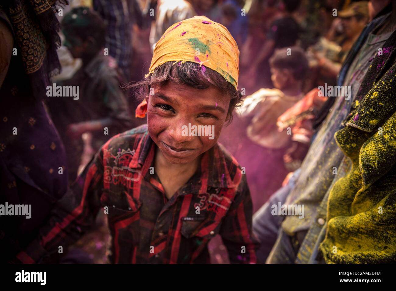 Boy covered with gulal during Holi. Mathura, India Stock Photo - Alamy