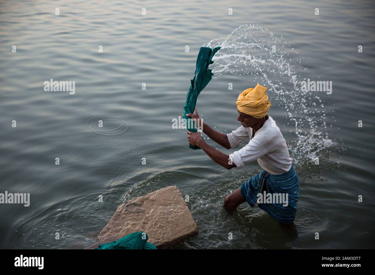 Man washing clothes in the Ganges. Varanasi, India Stock Photo - Alamy