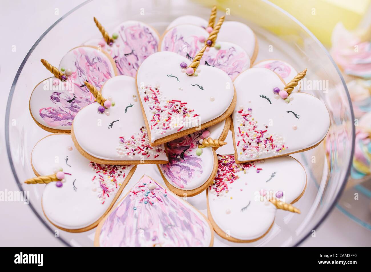 Gingerbread cookies covered with multi colored icing in pale pastel ...