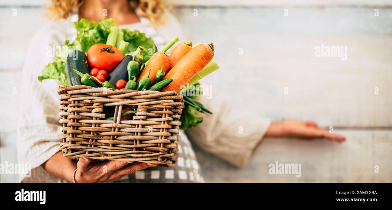 Caucasian woman people with bucket full of coloured and mixed fresh ...