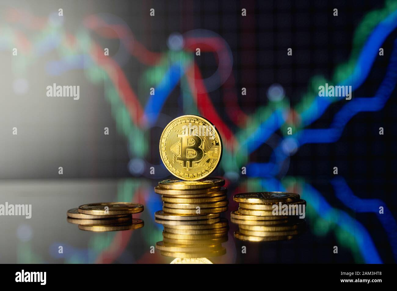 Bitcoins and virtual money concept. Gold bitcoins on a stack of coins ...