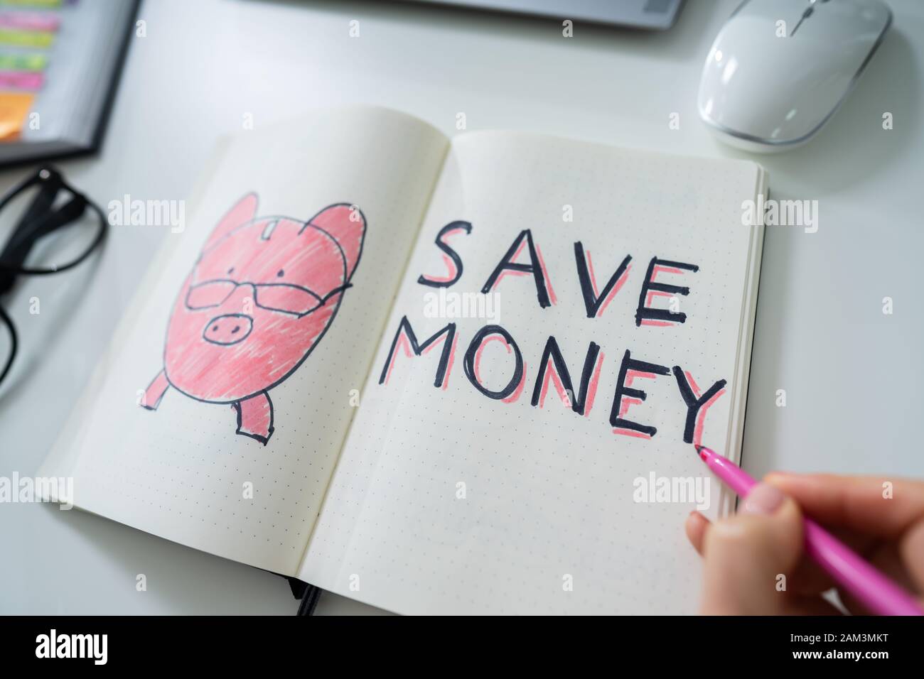 Businessperson Drawing Save Money Concept In Notepad Stock Photo - Alamy