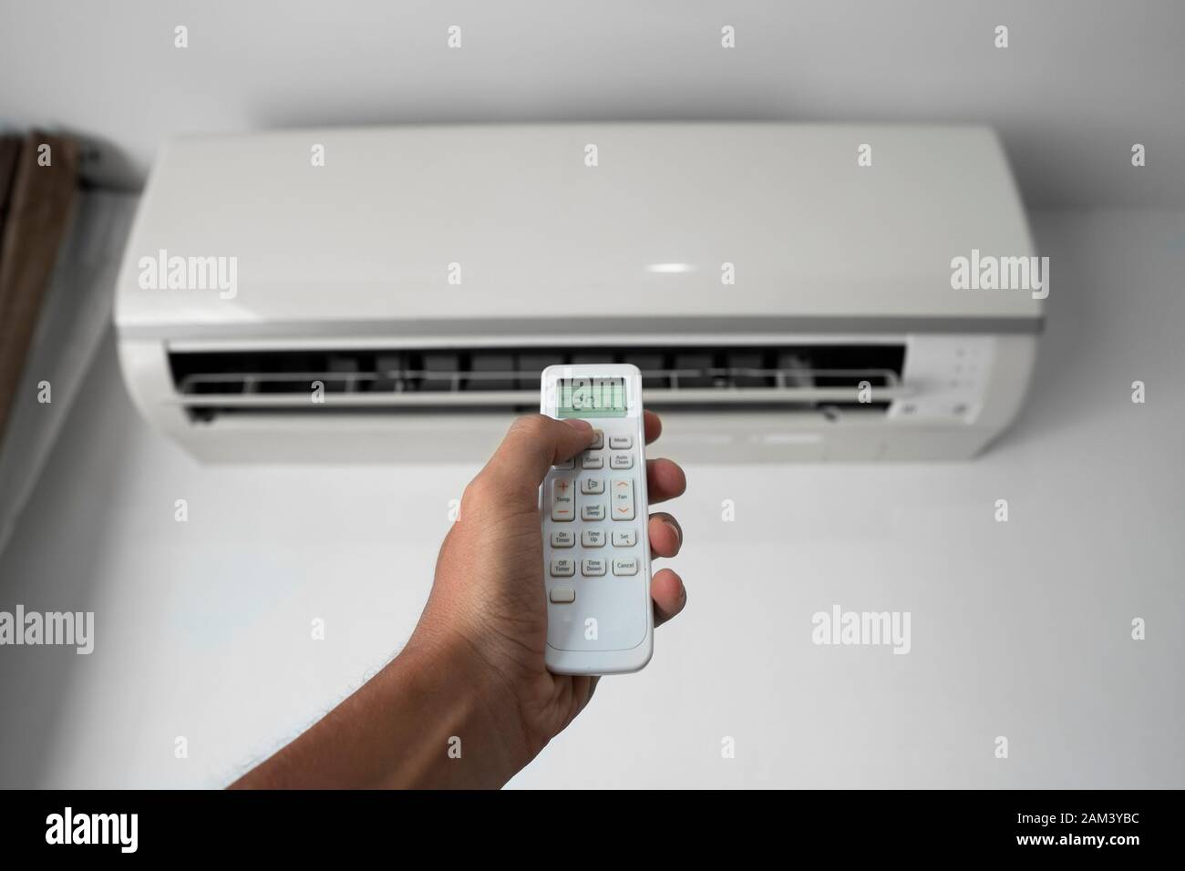 Man's hand using remote controler. Hand holding rc and adjusting ...