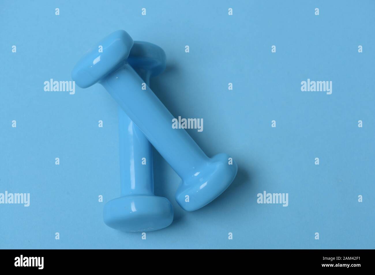 Barbells in small size, top view and copy space. Health regime and ...