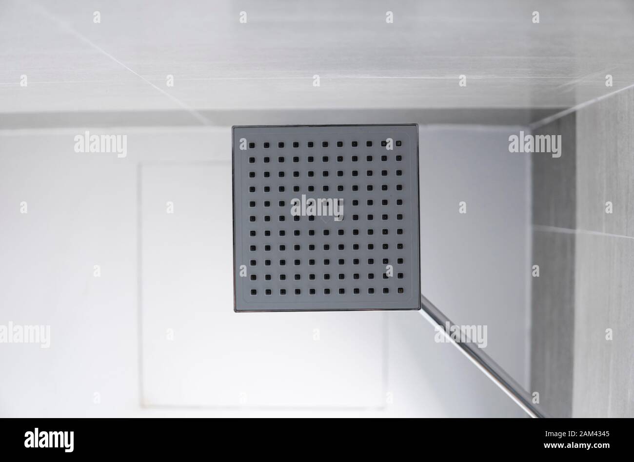 Square shower head in a modern bathroom. Shower in the bathroom with ...