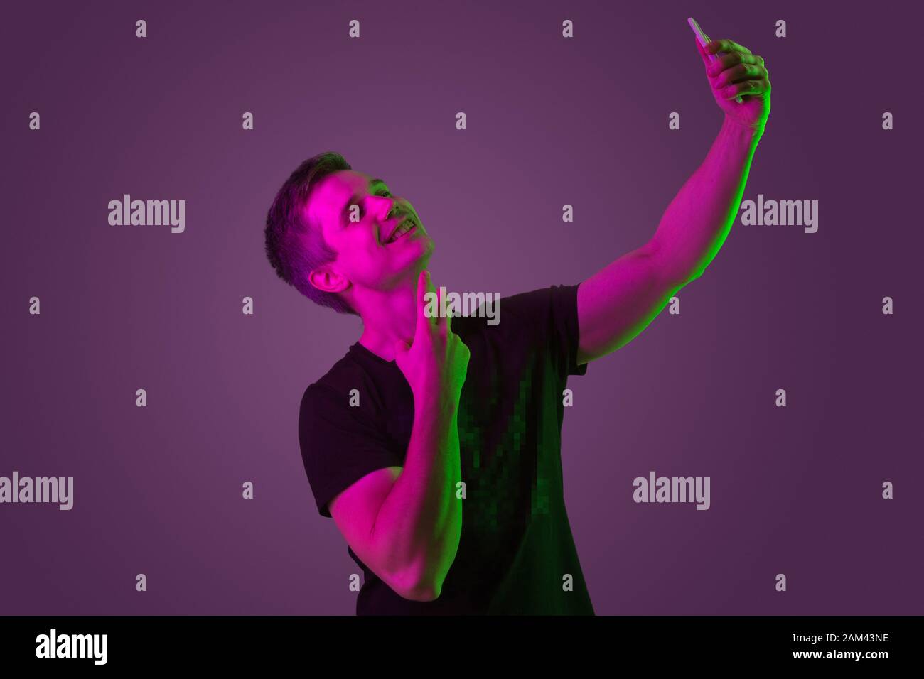 Using smartphone, taking selfie, vlog. Caucasian man's portrait on ...