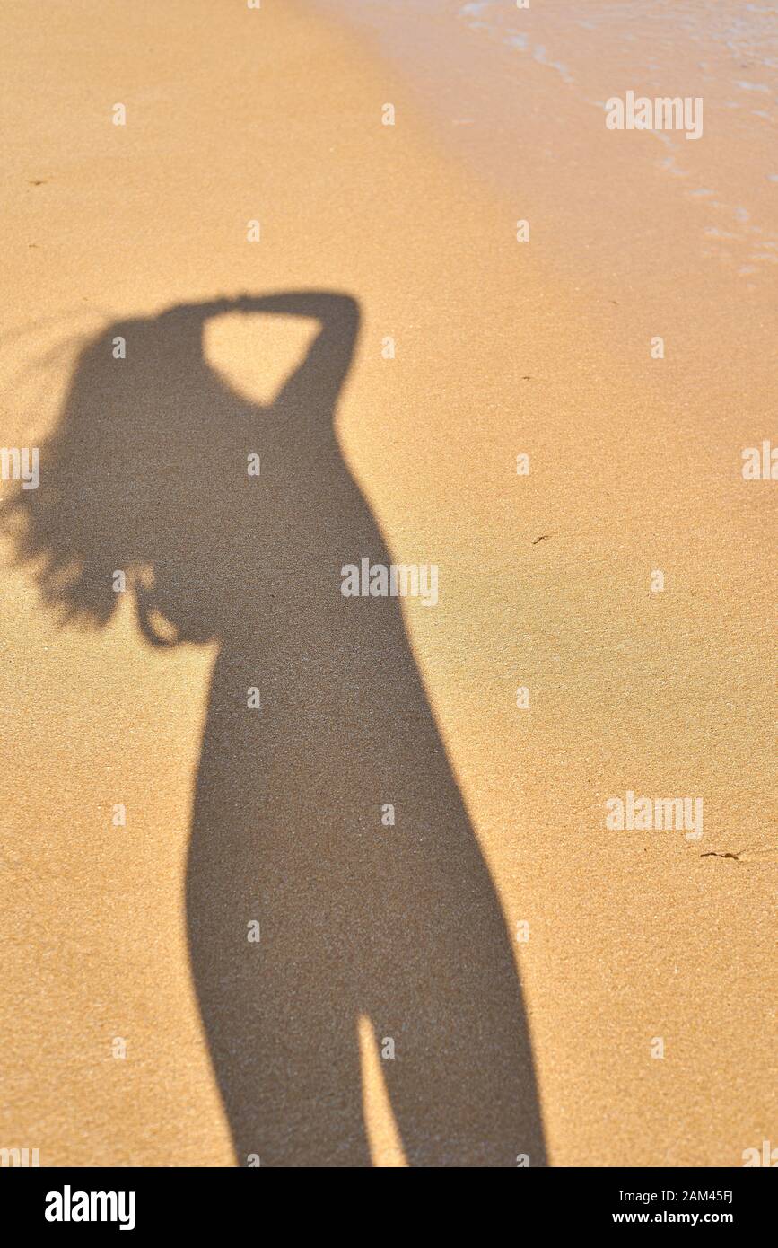 shadow from the photographer girl in the sand, silhouette in the sand ...