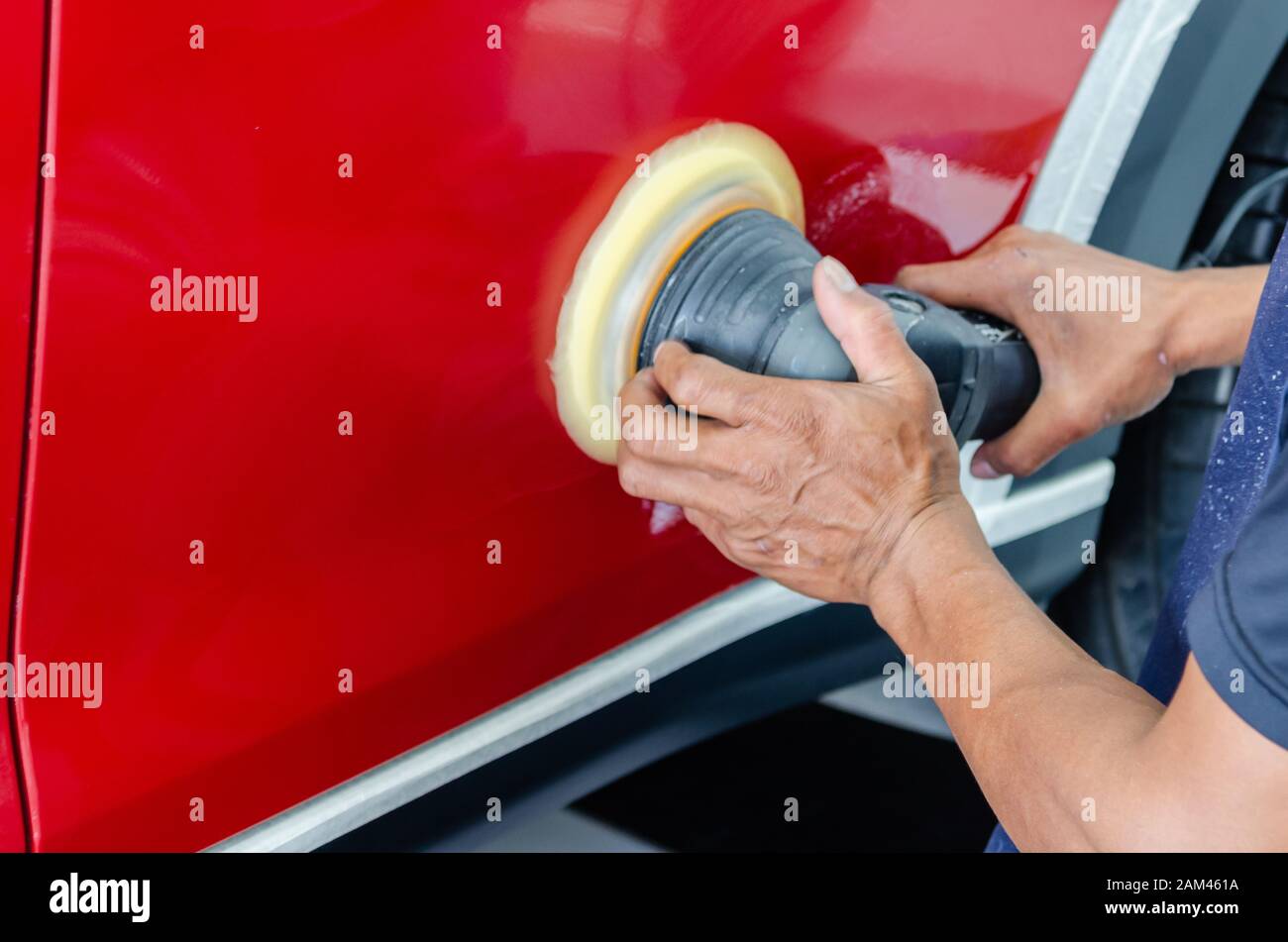 Man hands holding the work tool polish the car.Buffing and polishing ...