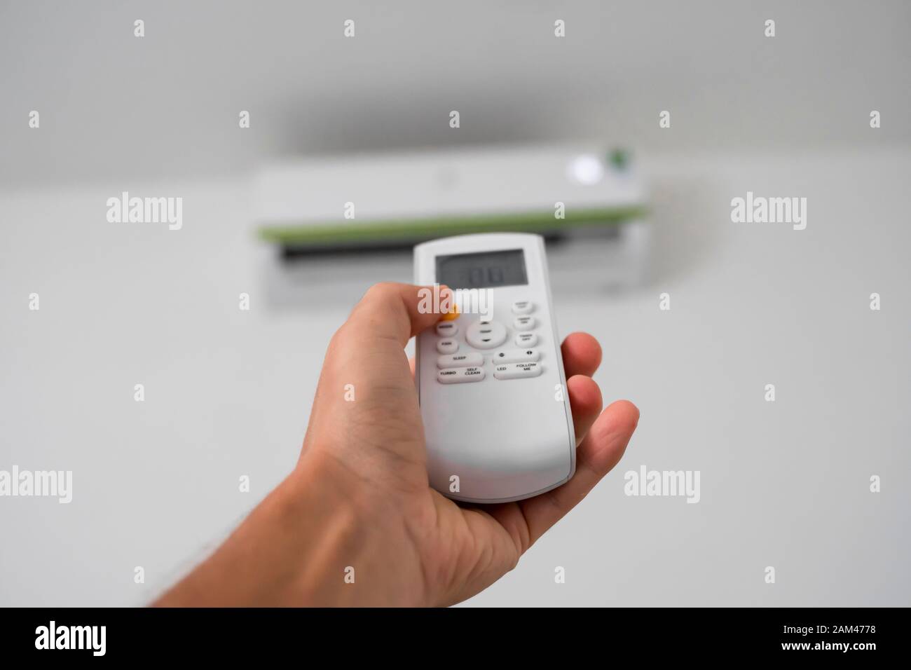 Man's hand using remote controler. Hand holding rc and adjusting ...