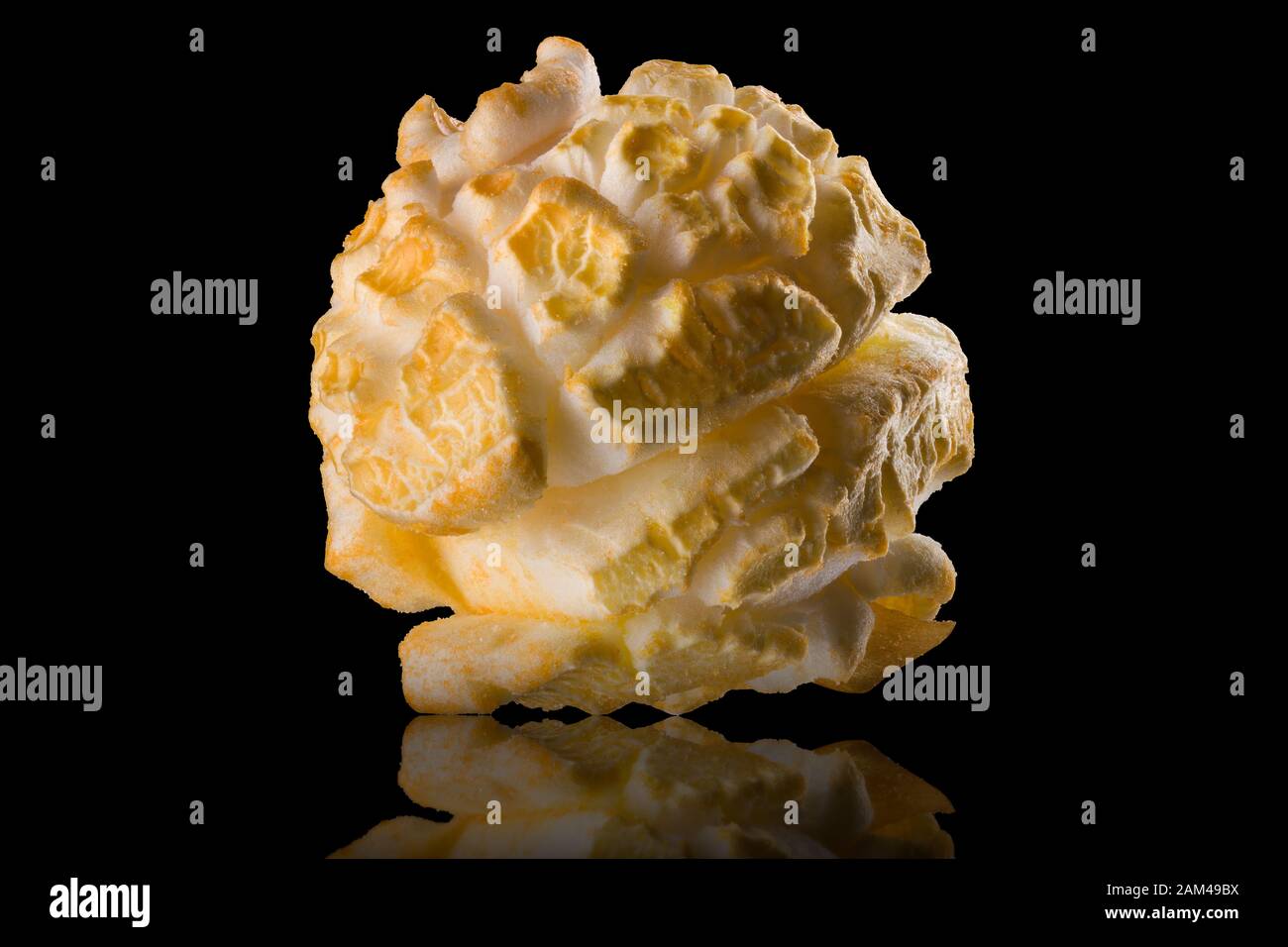 Single popped popcorn on a black backgroundwith clipping path Stock ...