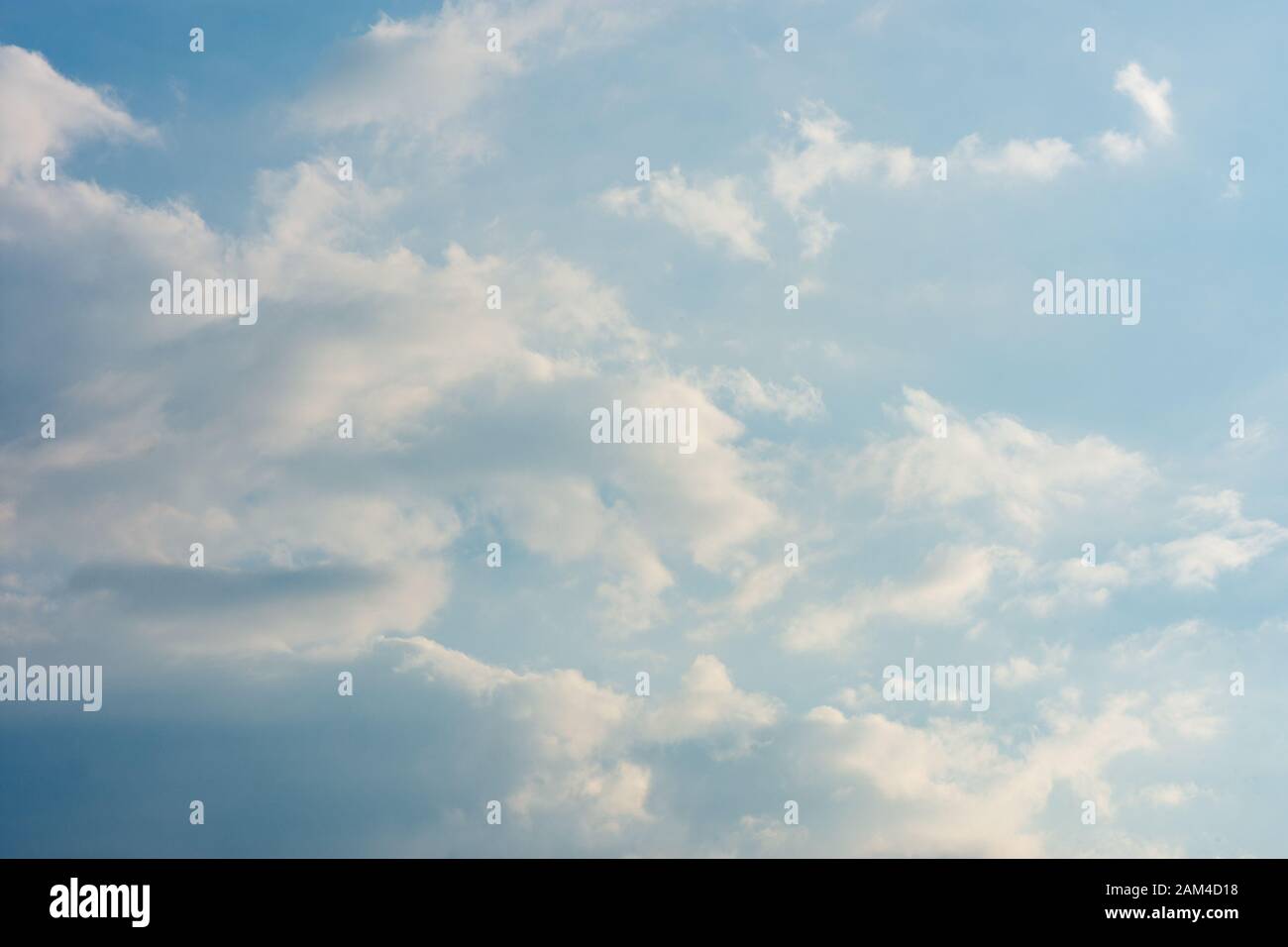 texture of the sky clouds and rays of sun on a background of blue sky ...