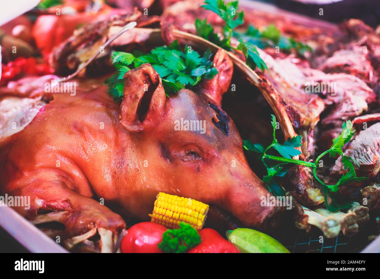 Big giant dish plate with roasted full pig pork head, served in ...