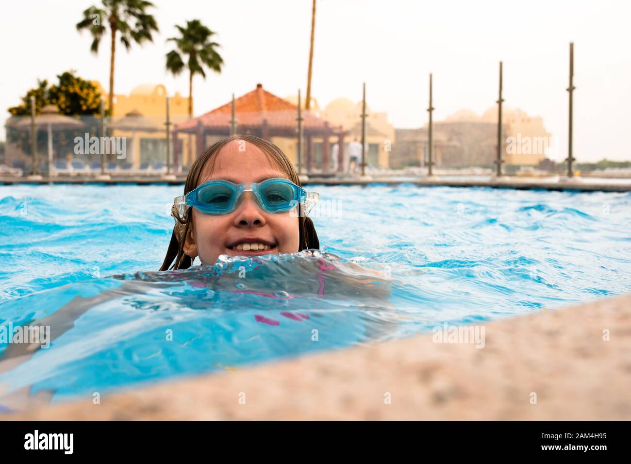 Underwater Young Girl Fun In The Swimming Pool With Goggles Summer