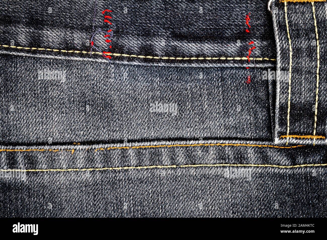 Black jeans fabric with strap background. Jeans detail. Black jeans ...
