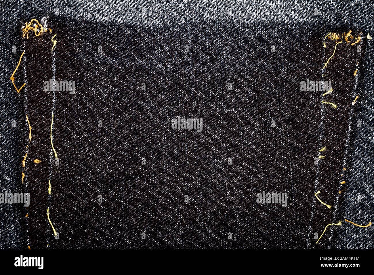 Black jeans fabric with ripped of pocket background. Jeans detail ...