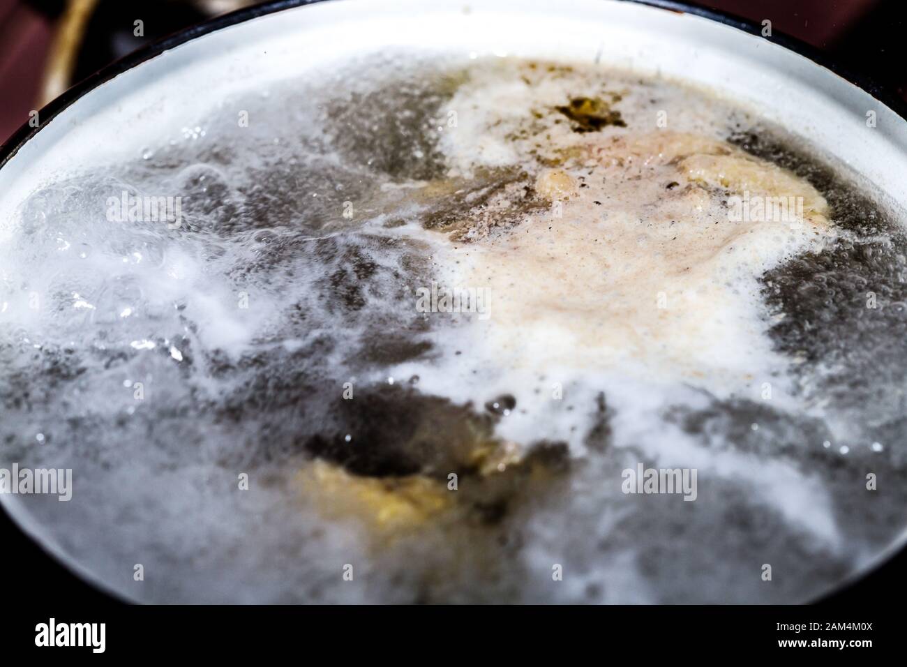 Boiling foam in a saucepan on an electric stove Stock Photo - Alamy