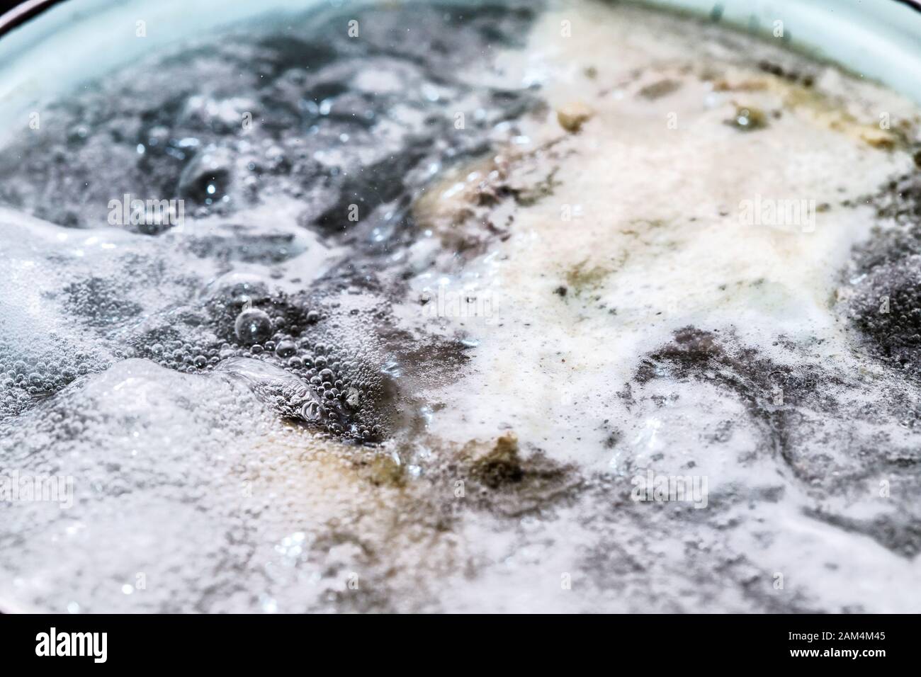 Boiling foam in a saucepan on an electric stove Stock Photo - Alamy