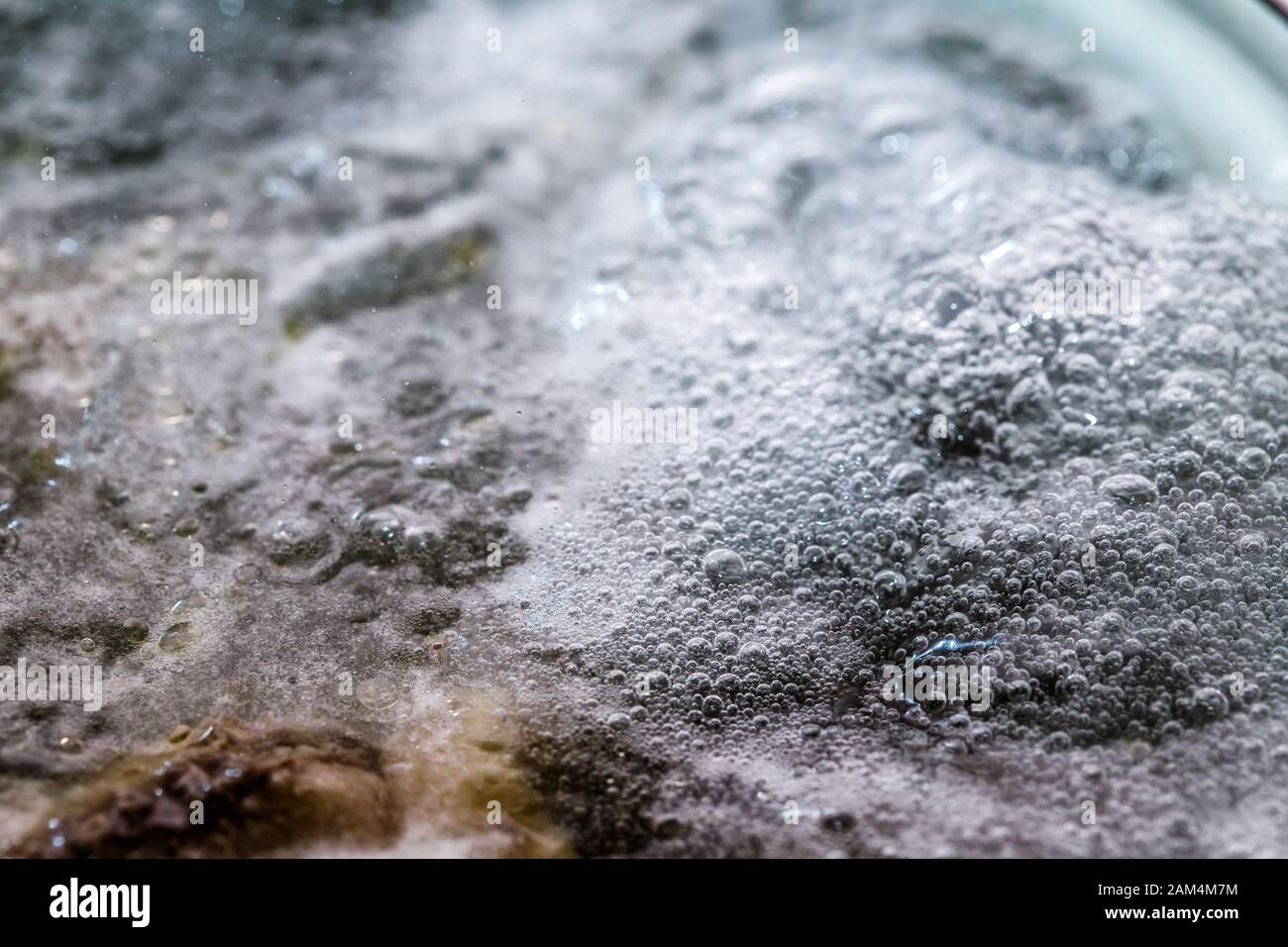 Boiling foam in a saucepan on an electric stove Stock Photo - Alamy