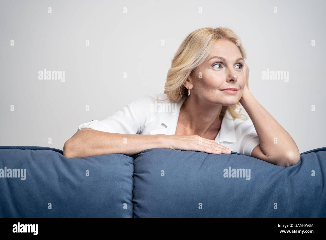 Woman leaning on elbow hi-res stock photography and images - Alamy