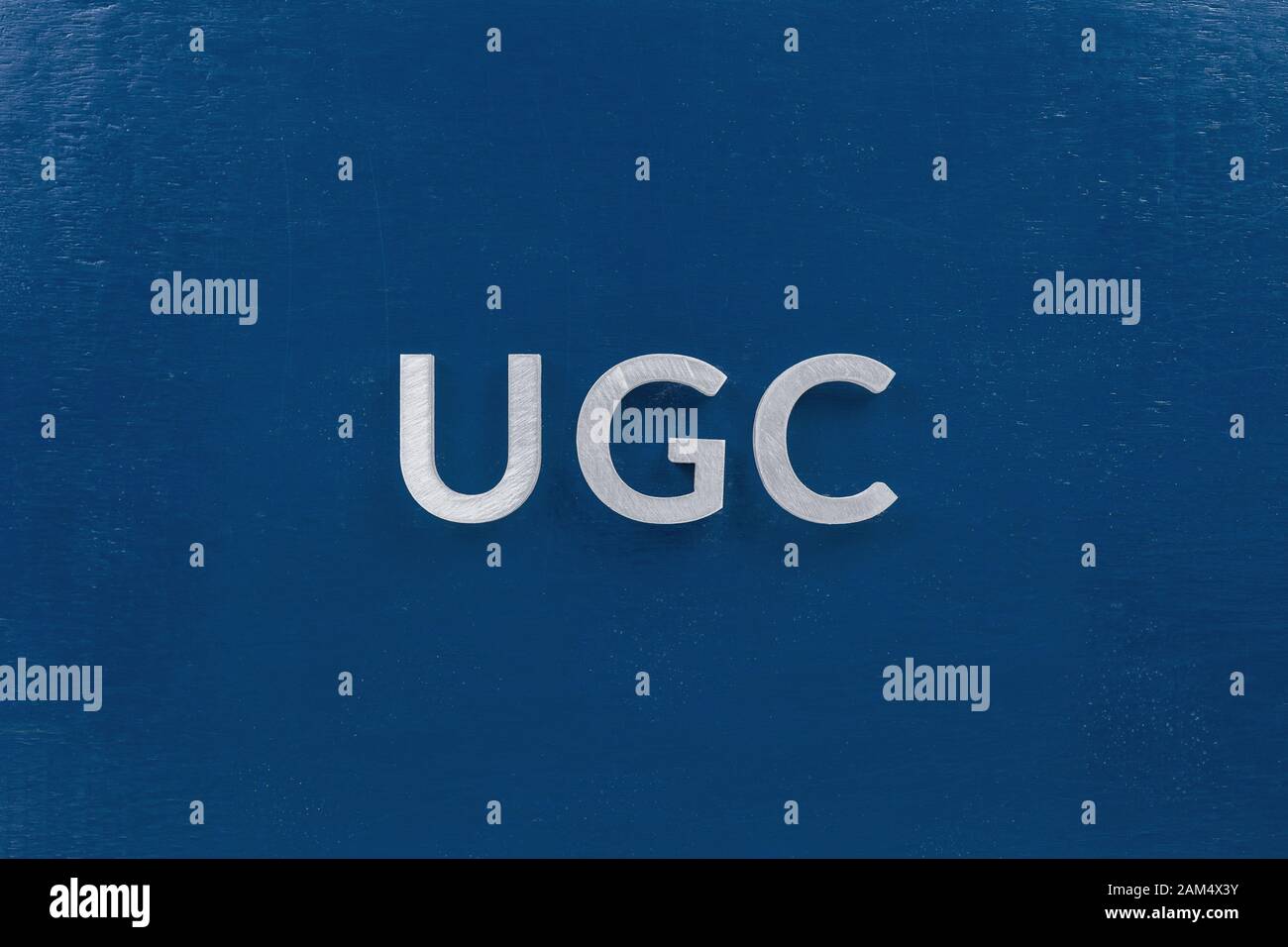 the word ugc - user generated content - laid by white silver metal ...